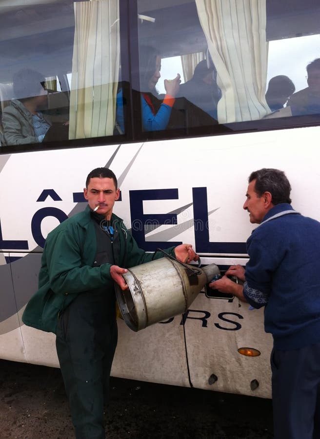 Smoking Egyptian Driver is Fueling the Bus Editorial Photography ...