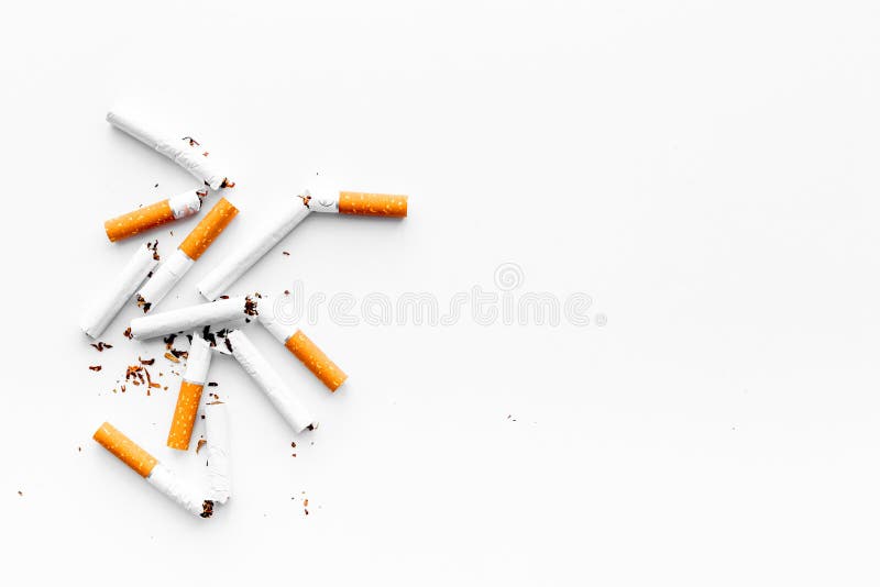 Smoking. Half-smoked Cigarettes with Ash on White Background Top View ...