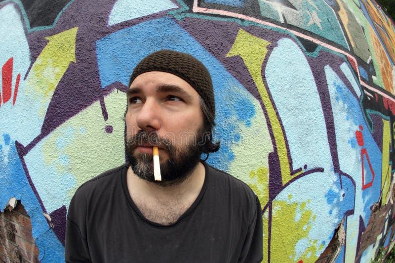 Smoking homeless man stock photo. Image of wall, outside - 6288198