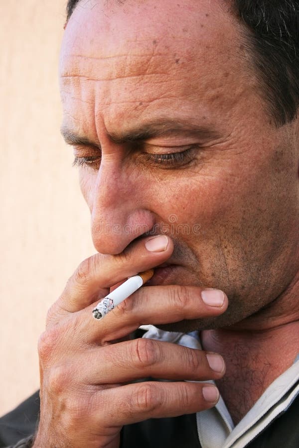 Smoking man stock image. Image of hopelessness, eyes - 12135571