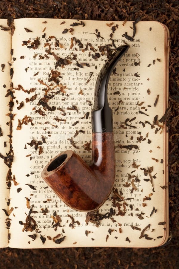 Smoking pipe on a book stock image. Image of enjoyment - 35224373