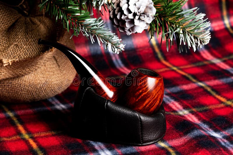 Smoking Pipe Close - Up on a Background of Vintage Plaid and a Fragment ...