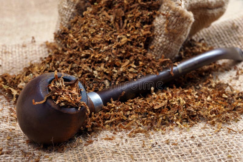 Smoking Pipe and Tobacco on Wooden Table. Close Up Stock Image - Image ...