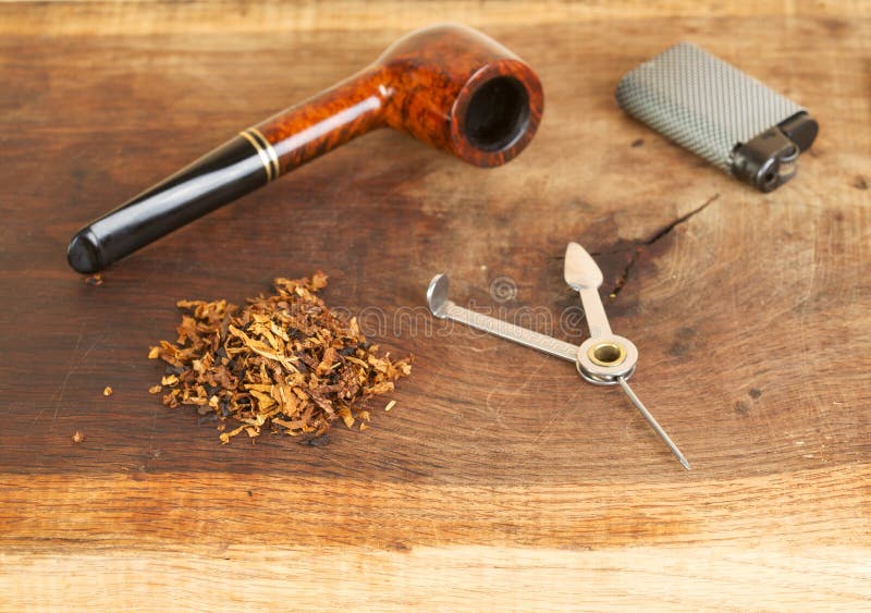 Smoking Pipe on a Wooden Table. Aroma Stock Image - Image of pipe ...