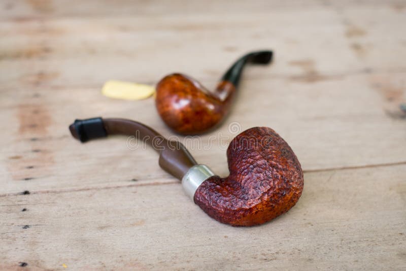Smoking Pipes on the Wood Table , Close Up Stock Photo - Image of heap ...