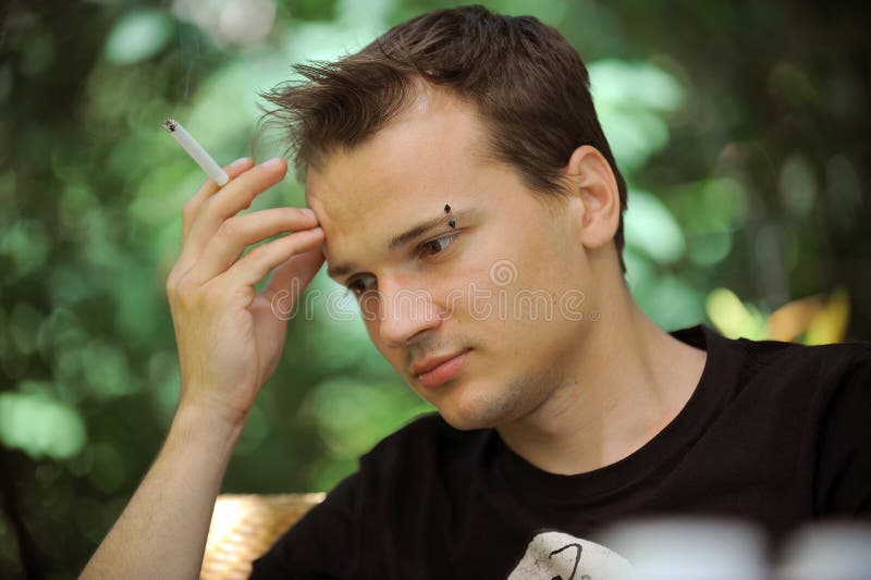 Smoking young man stock photo. Image of human, background - 22688718