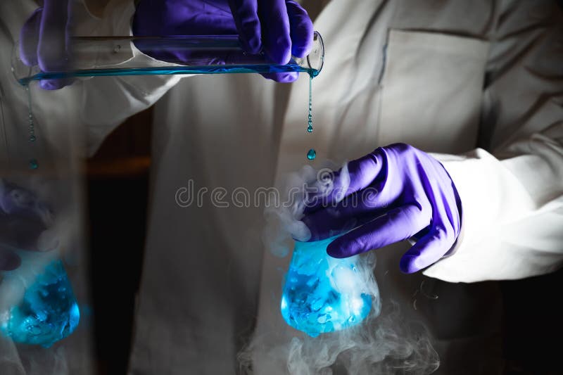 Smoky Experiments with Blue Colour Solution. Scientist Working on ...