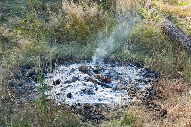 Smoldering Camp Fire stock image. Image of burning, cleanup - 31257411