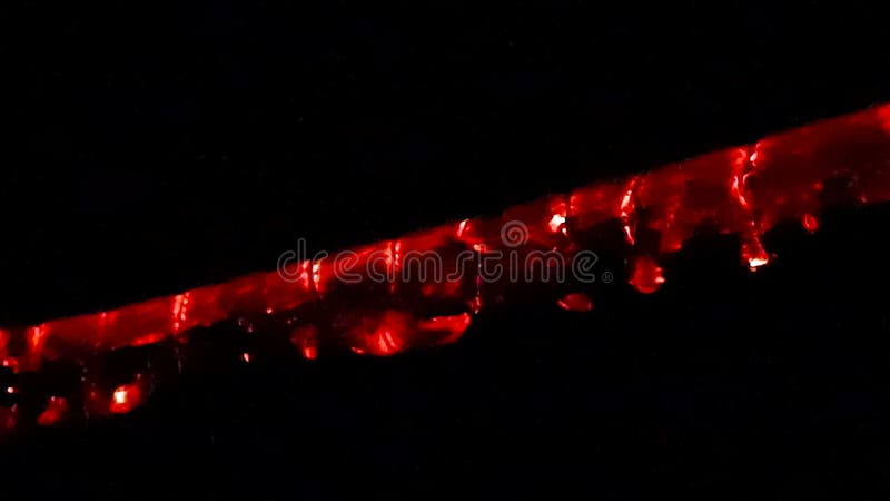 Smoldering Heat and Burning Log in a Fireplace. Sparks on a Black ...