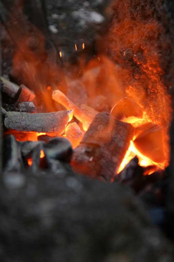 Smoldering hell stock photo. Image of handwork, hands, hammer - 897520