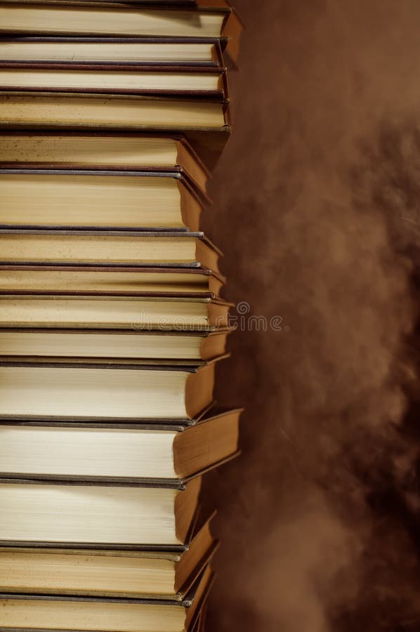 Smoldering Stack of Books stock image. Image of bunch - 30366563