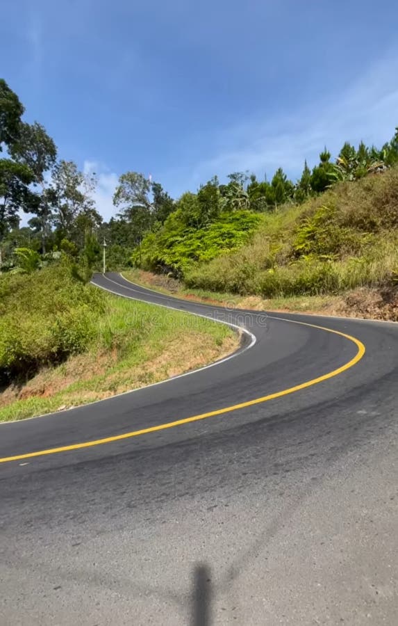 Smooth and Beautiful Winding Road Surrounded by Mountains Stock Image ...