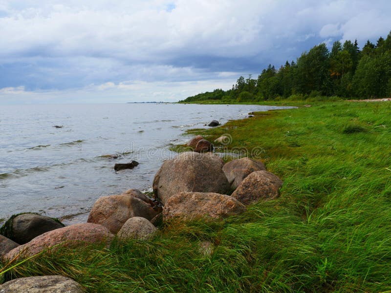 Boulders, Lake, and Cloudy Sky. Stock Photo - Image of lake, peaceful ...