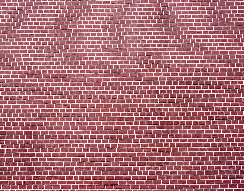 A Smooth Brick Wall of a Cold Red- Brown Color with White Joints ...