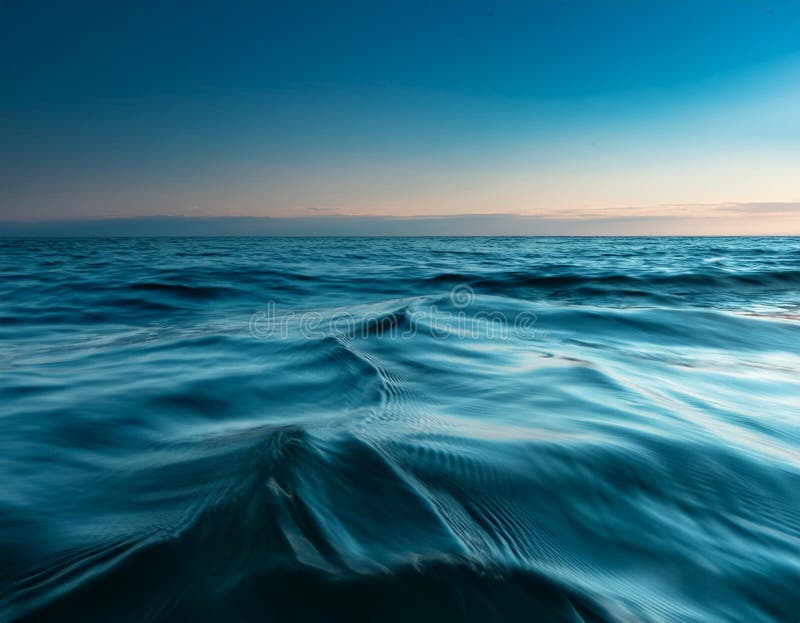 Smooth Glassy Waves on a Still Ocean at Dusk Stock Photo - Image of ...