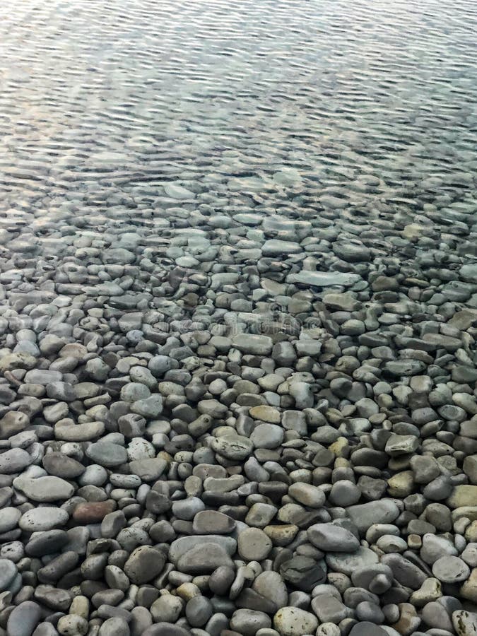 Smooth Limestone Rocks in Calm Rippled Water Stock Photo - Image of ...
