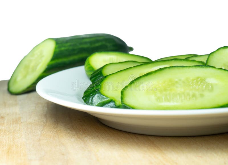 A Smooth, Medium-sized Cucumber Cut into Slices. Cucumber on a Plate ...