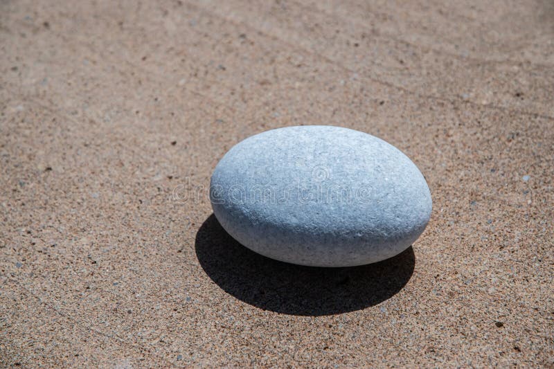 Smooth oval pebble stock image. Image of rock, closeup - 324141333