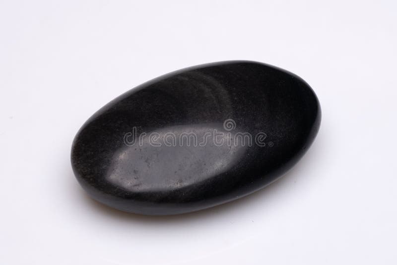 Smooth, Polished Black River Stone Isolated on a Plain White Background ...