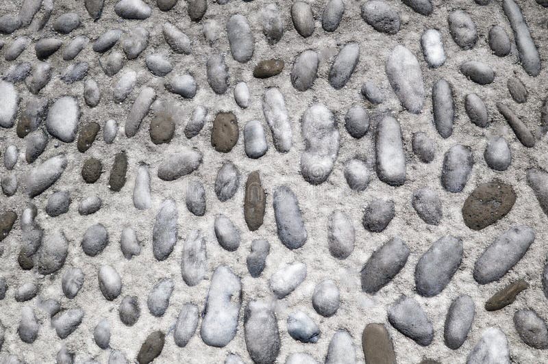 Pebbles and Cement Creating a Textured Surface Background Stock Photo ...