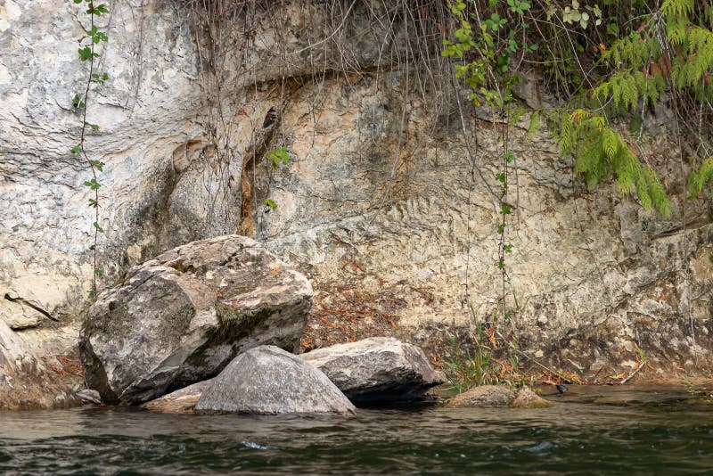 A Smooth Rock Wall on the Edge of a River Stock Photo - Image of high ...
