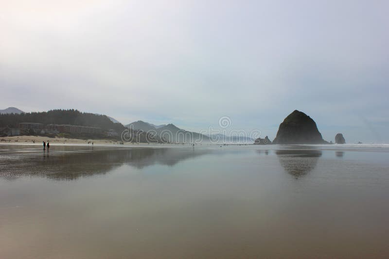 Cannon Beach Oregon and Haystack Rock Stock Image - Image of reflection ...