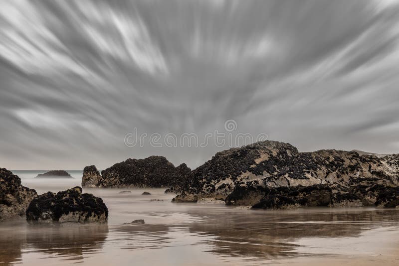 Smooth Sea and Rough Rocks on the Atlantic Coast in Cornwall. and a ...