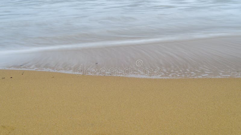 The Smooth Silky Waves and Seafoam on the Sandy Beach, Long Exposure ...