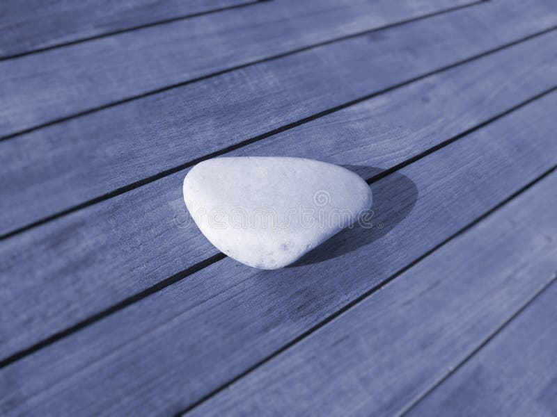 Smooth stone on wood stock photo. Image of wooden, closeup - 14096692