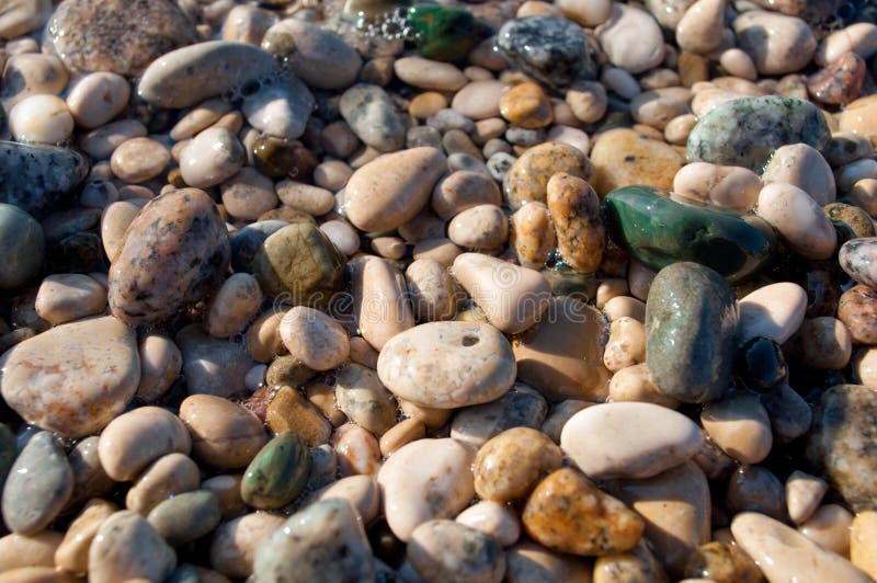 Many Small Stones on the Shore of a Clean Lake. Stock Image - Image of ...