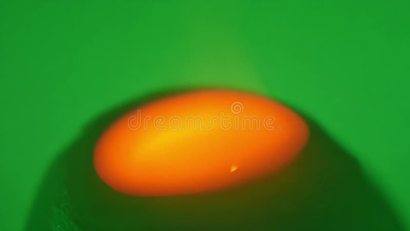 The Smooth Surface of the Ember Reflects the Surrounding Green Hue ...