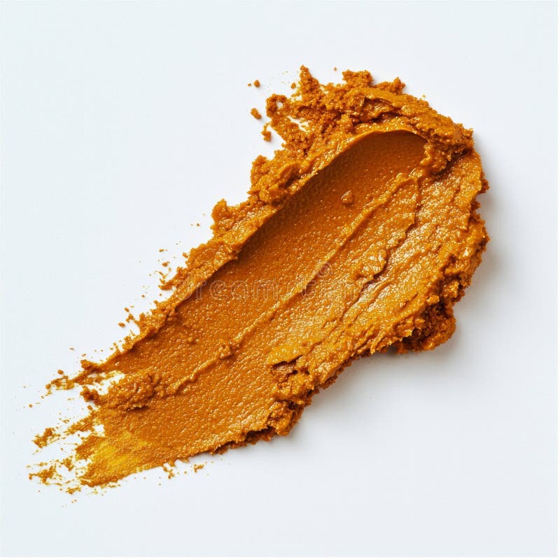 Smooth and Textured Swipe of Vibrant Mustard Yellow Paste on White ...