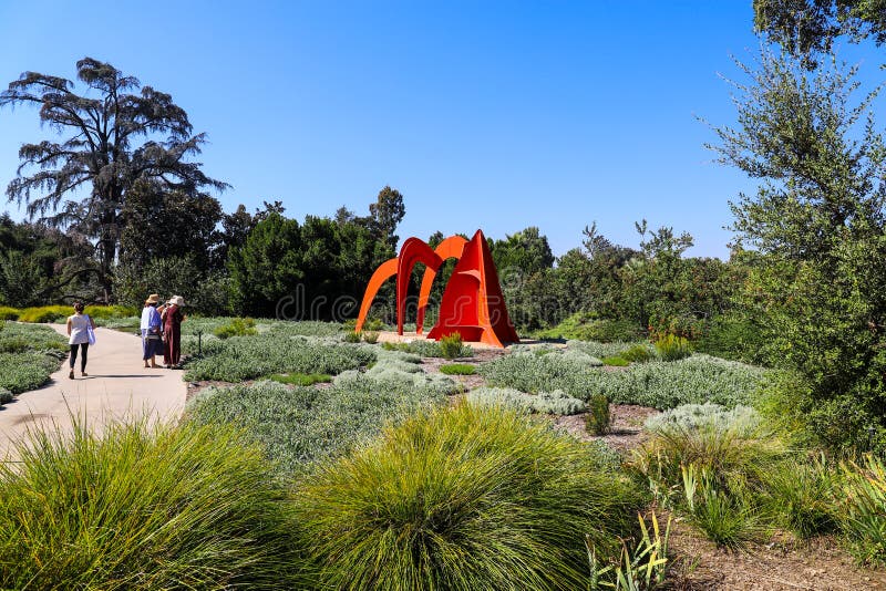 A Smooth Walking Path in the Park with People Walking Along the Path ...