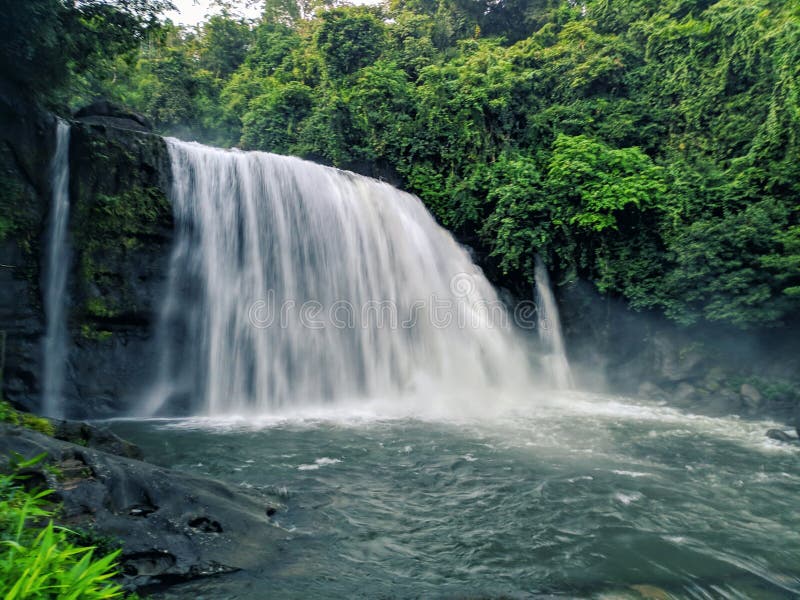 Smooth waterfall and rocks stock photo. Image of white - 5469666