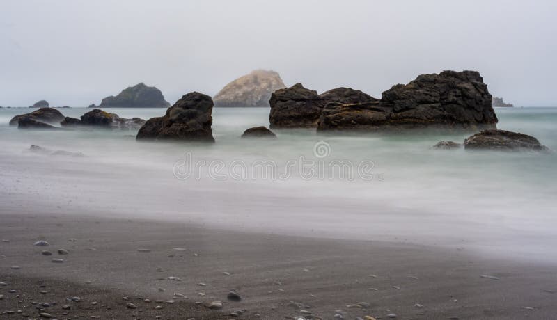 Smooth Waves Flow among Rocks Stock Image - Image of rock, rocks: 104328193