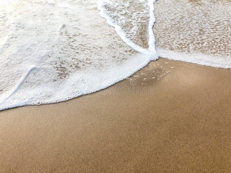 Smooth Waves of the Sea on the Sandy Beach in Summer Stock Photo ...