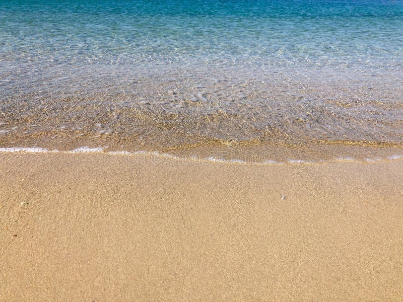Smooth Waves of the Sea on a Sandy Beach in Summer Stock Photo - Image ...
