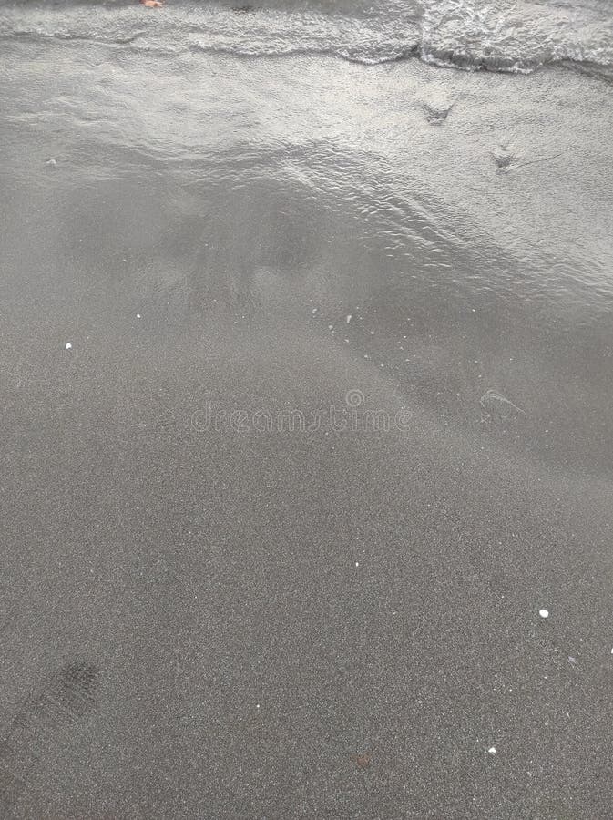 Smooth, Wet Sand with Subtle Wave Patterns on a Beach Stock ...