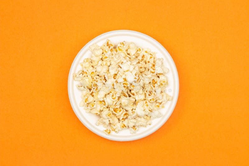 Snack Concept, Sweet Popcorn in White Plate in the Middle of Orange ...