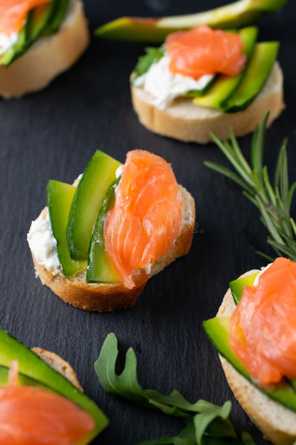 Snacks, Bruschetta with Cream Cheese, Avocado and Salmon Stock Image ...