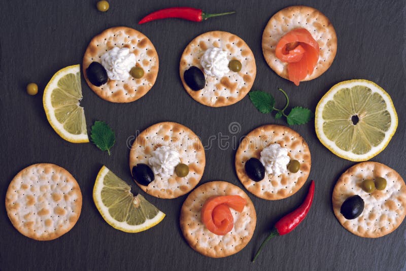Snacks with Cheese and Red Fish. Crackers with Fish and Cheese. Stock ...
