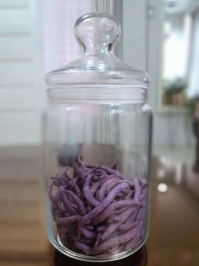 Purple snacks stock image. Image of bottle, purple, crispy - 261744951