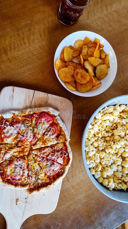 Snacks on the Table. Pizza, Chips and Popcorn Stock Photo - Image of ...