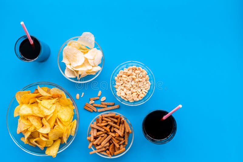 Snacks for TV Watching. Chips, Nuts, Soda, Rusks on Blue Background Top ...