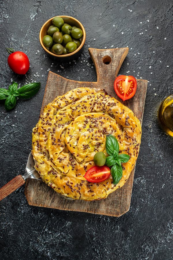 Snail Pie Borek with Meat on a Wooden Board, Vertical Image. Top View ...