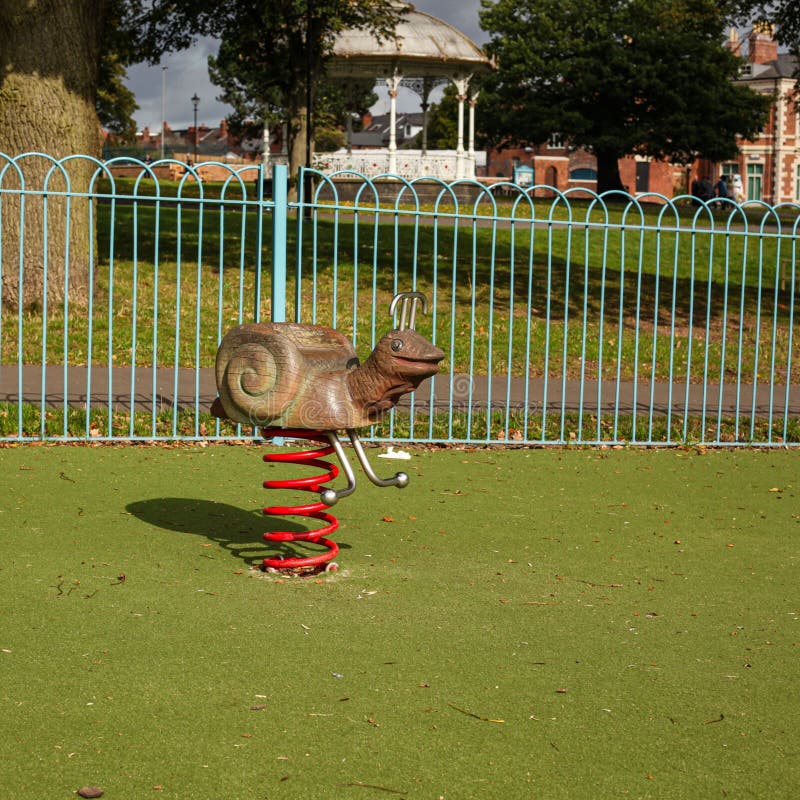 Snail-shaped Spring Rider Installed in a Public Park Setting Stock ...