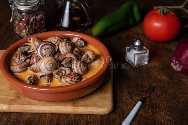 Snail stew stock image. Image of dish, pepper, tomato - 241865713