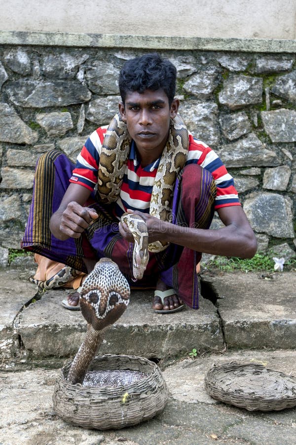 A Snake Charmer with His Cobra and Python Posing for a Photograph at ...