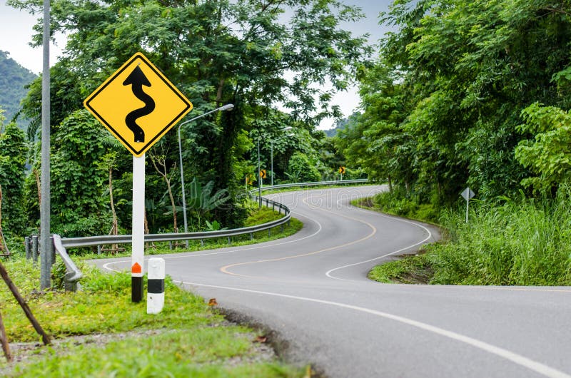 Snake Curved Road and Warning Sign Stock Image - Image of auto, green ...