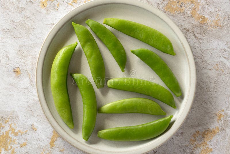 Snap Pea Pods on a Plate stock image. Image of fresh - 312896231